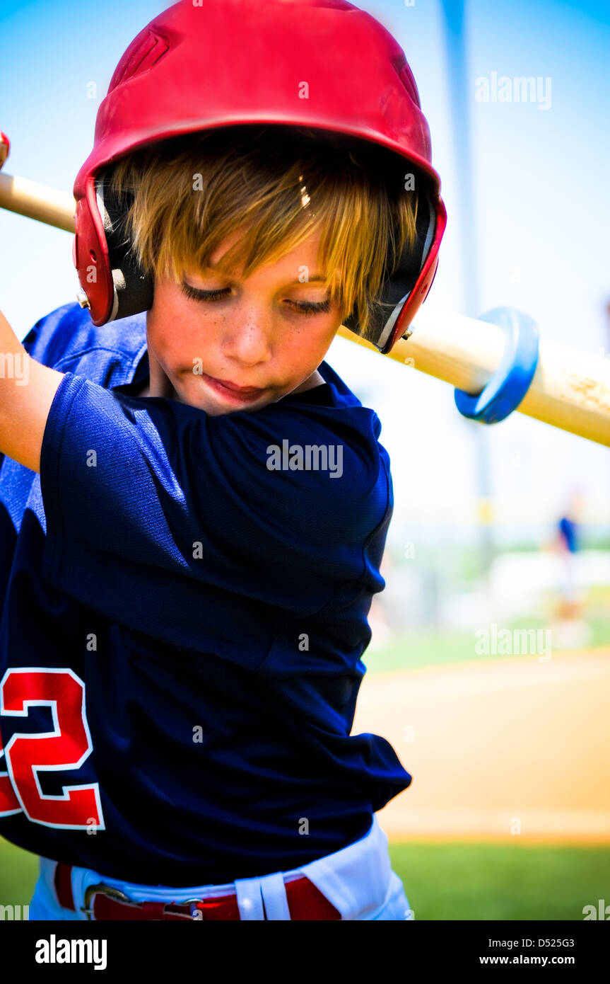 Little league batter warming up Stock Photo - Alamy