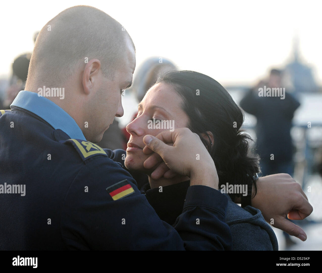 German Navy petty officer Martin Moldt (L) kisses farewell his ...