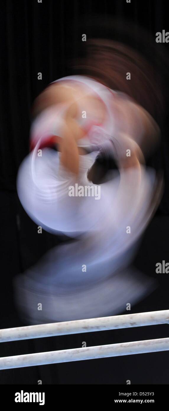 Taiwan's Huang Sheng Men competes in the bars discipline at the 2010 ...