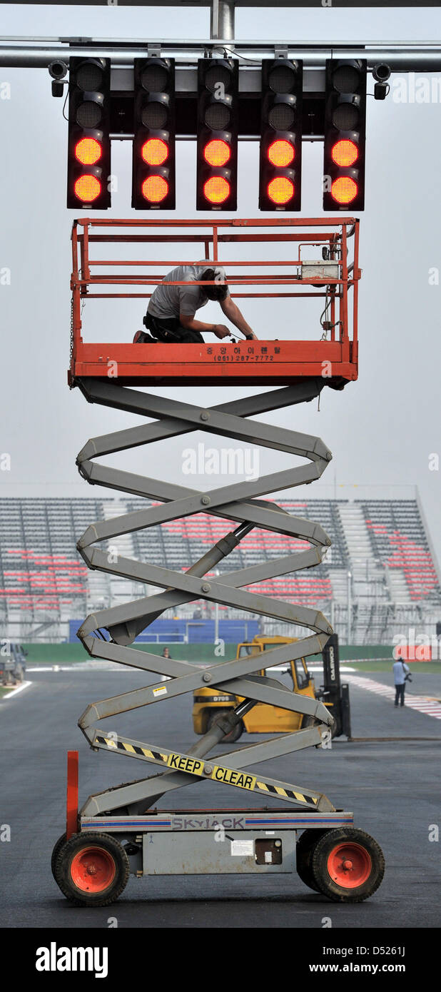 A technician works on the starting signal at the Korean International ...