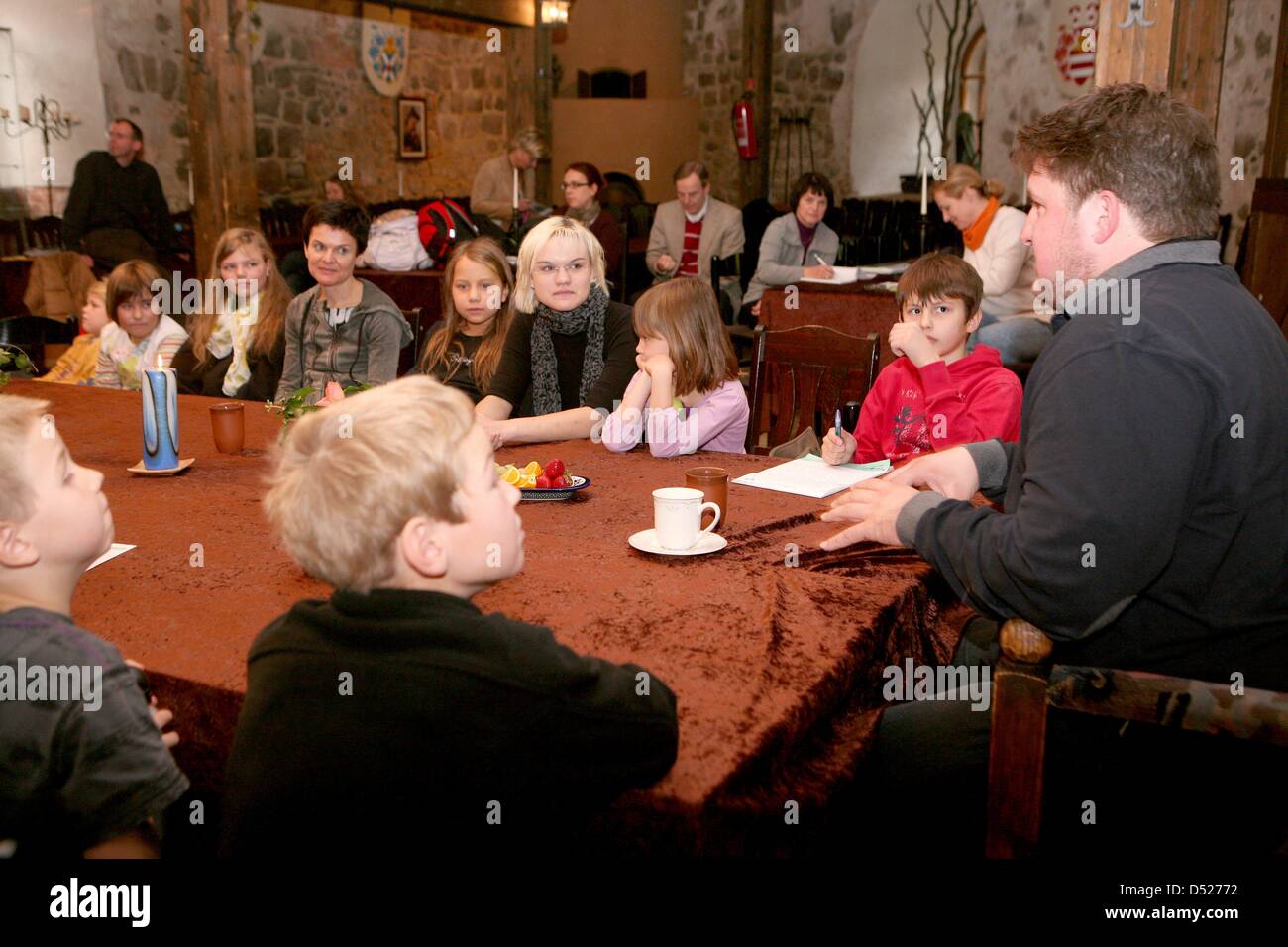 German Olympic weightlifting champion Matthias Steiner (C) talks with ...