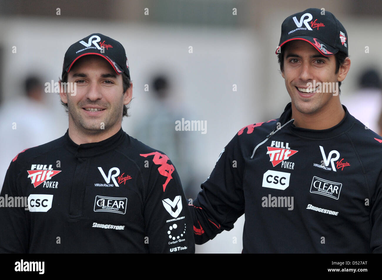 The German Formula One driver Timo Glock (L) of Virgin Racing smiles ...