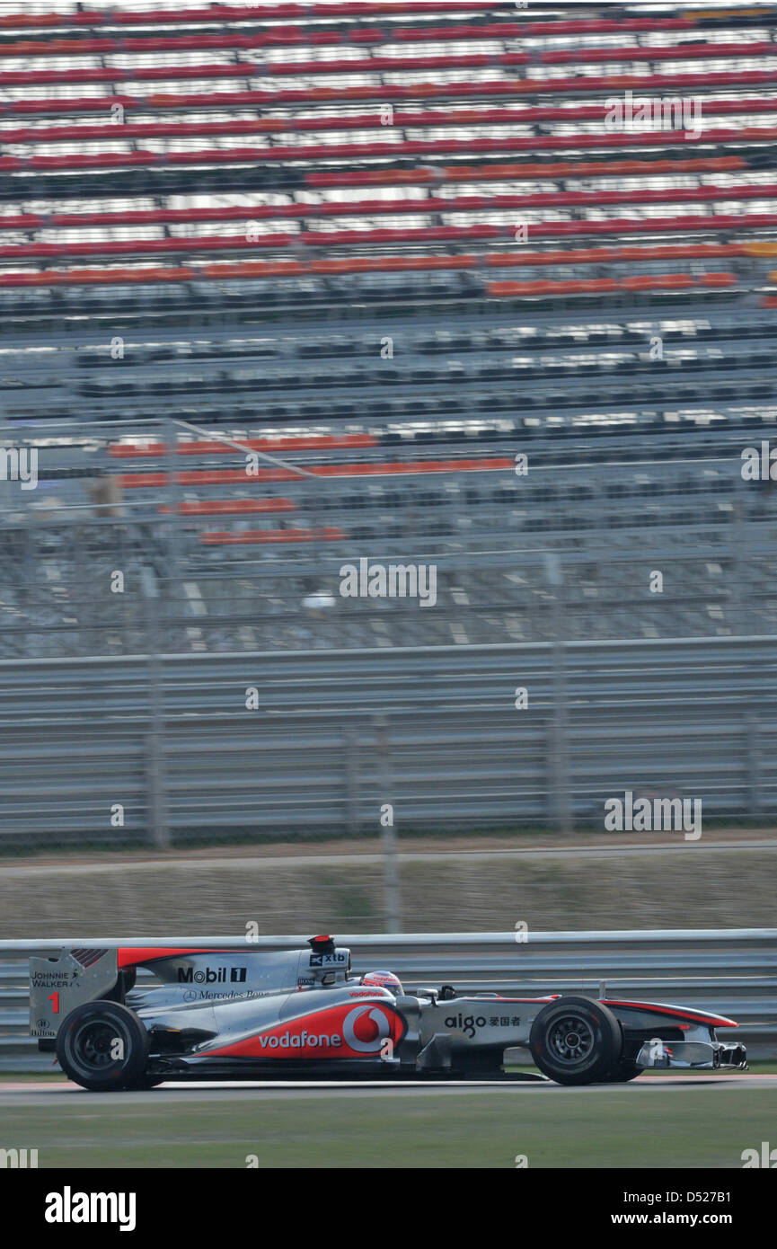 The British Formula One driver Jenson Button of McLaren drives his car ...