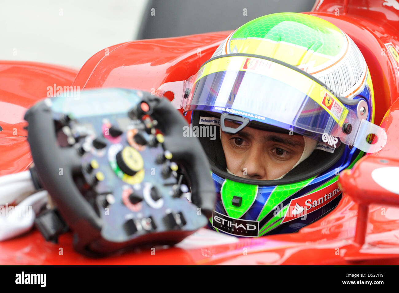 Brazilian driver Felipe Massa of Ferrari gets out of his race car in ...