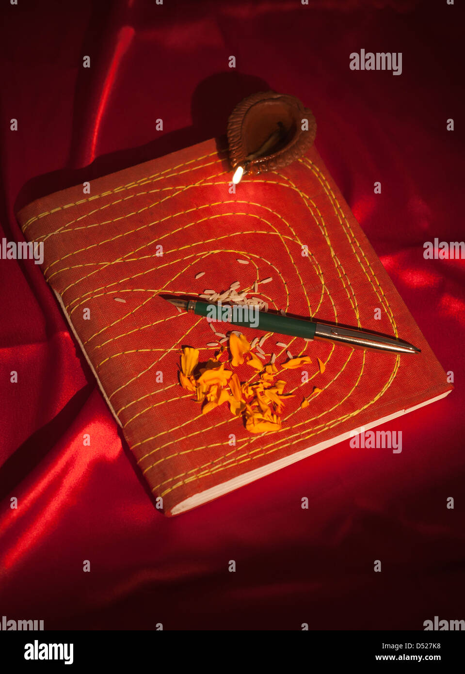 Diwali diya and a pen on ledger book during Diwali festival Stock Photo ...