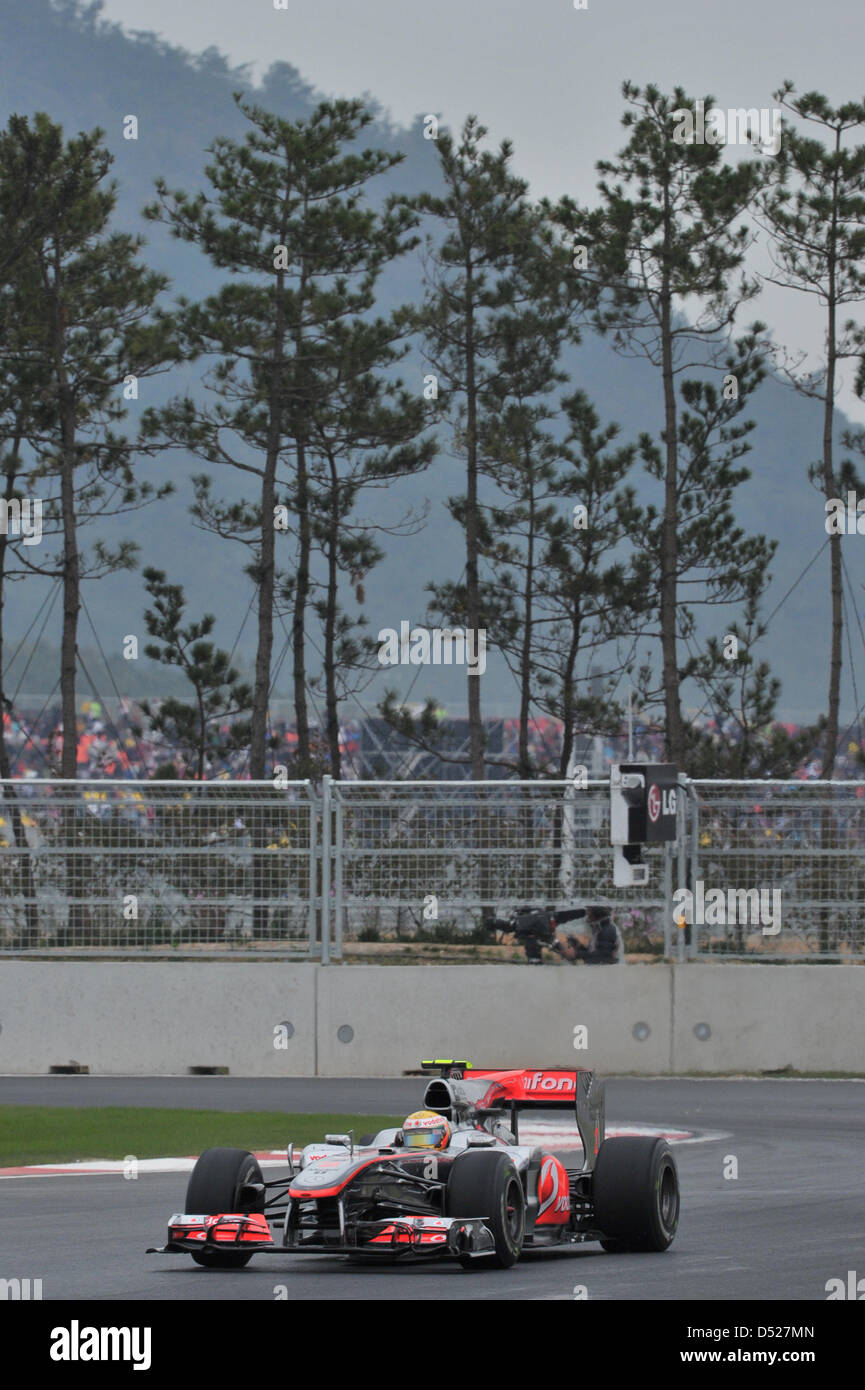 British driver Lewis Hamilton of McLaren Mercedes steers his car along ...