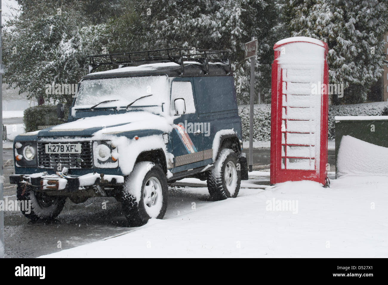 Two British icons covered in white snow - Land Rover Defender 90 parked ...