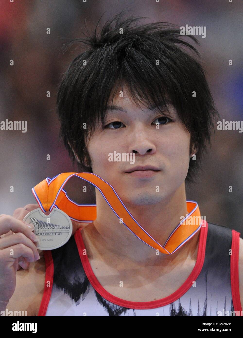 Kohei Uchimura from Japan is awarded with the silver medal during the ...