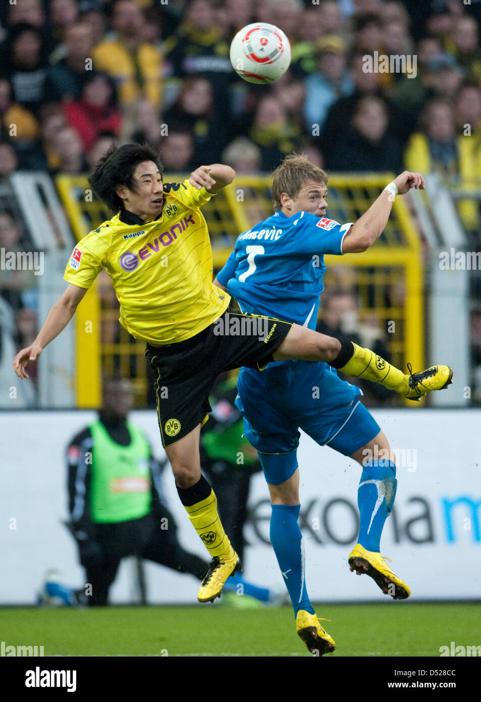 Dortmund's Shinji Kagawa in a header duel with Hoffenheim's Boris ...