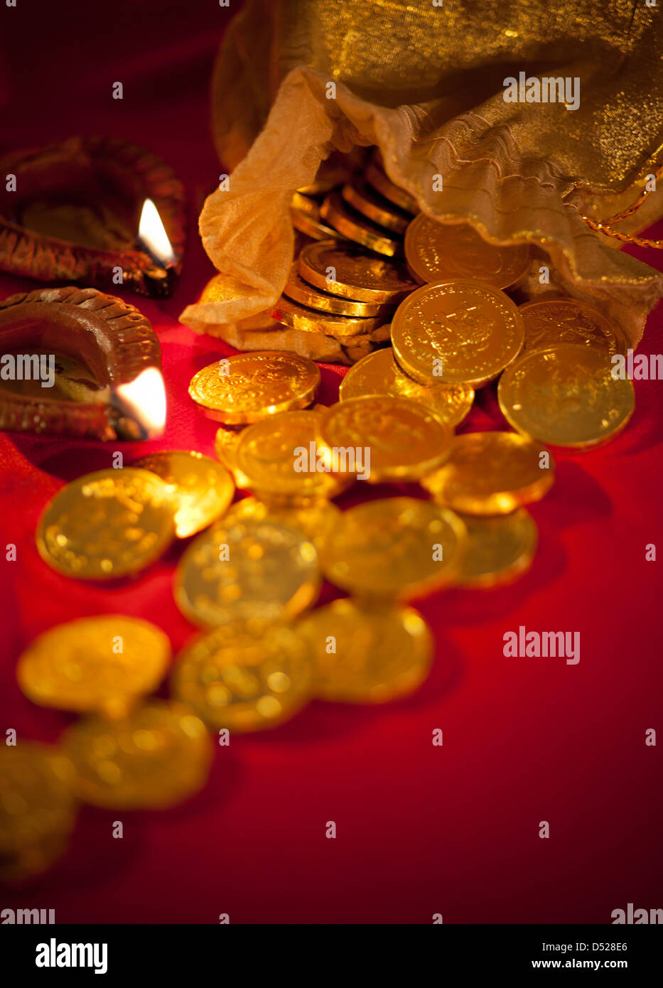 Diwali oil lamps with golden coins during Diwali festival Stock Photo ...