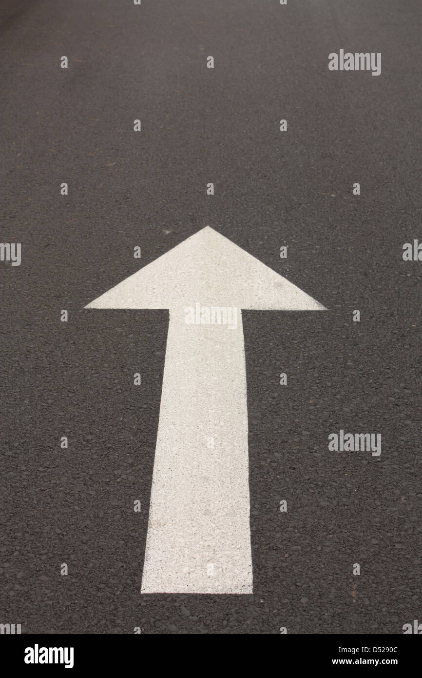 Arrow on the asphalt. Go ahead. Go straight. Traffic sign painted on ...