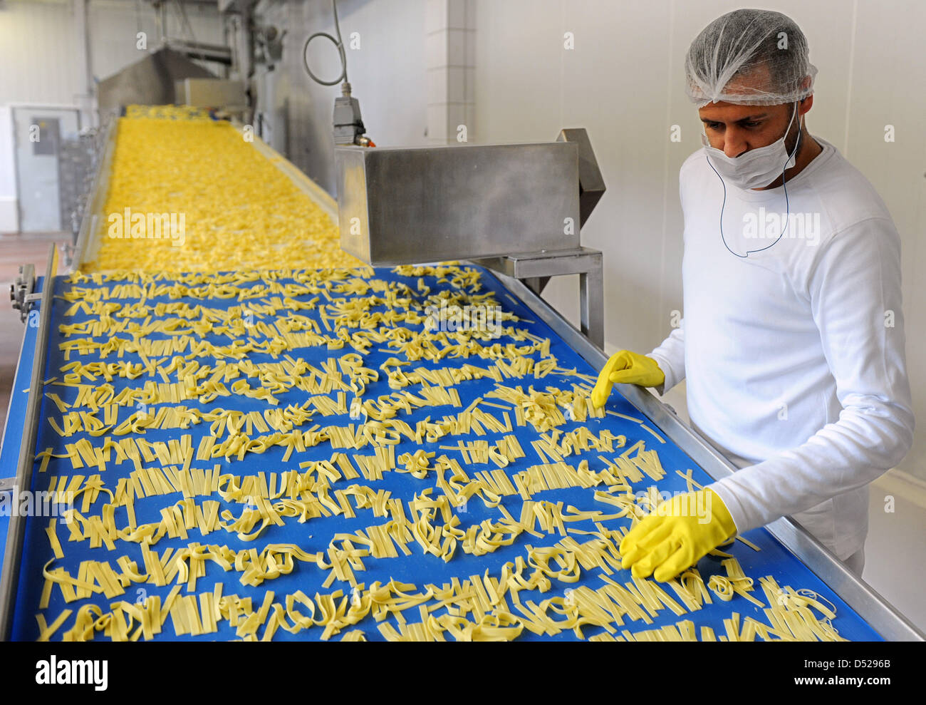 An employee of frozen foods manufacturer FRoSTA AG monitors the ...