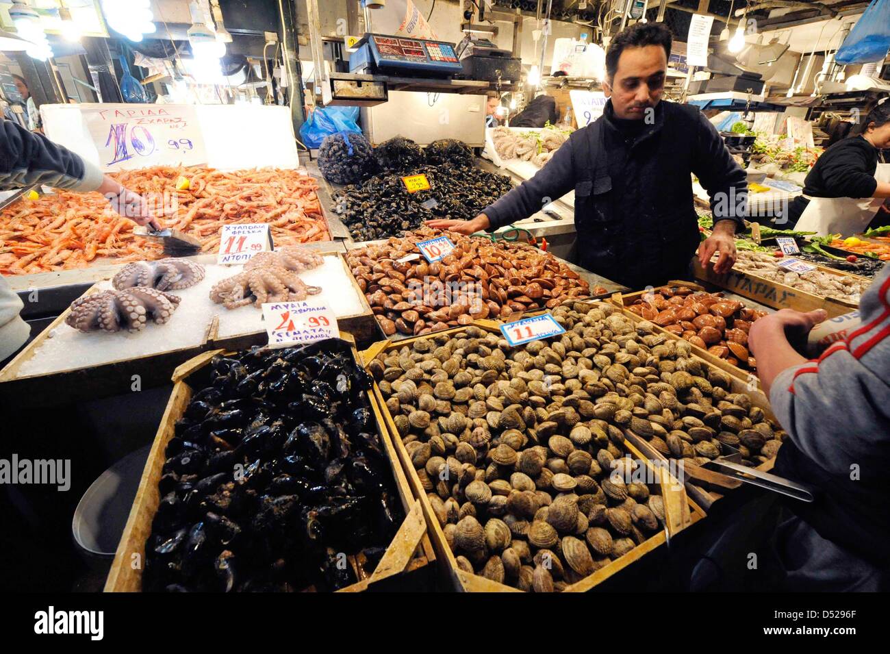 Merchants sell their fish and seafood on the Varvakios Markt in Athens ...
