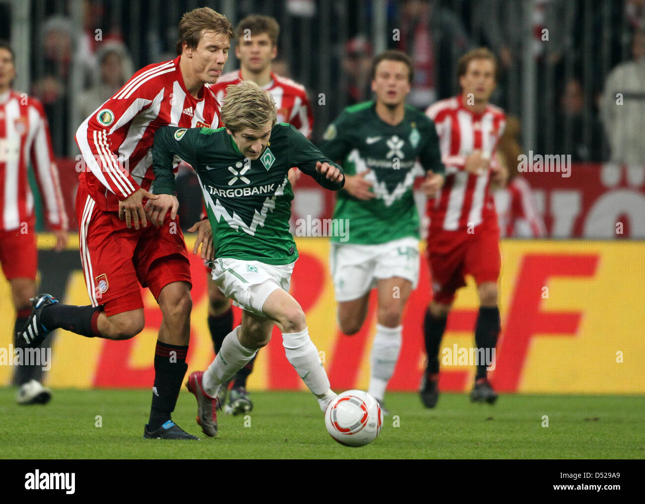 Munich's Holger Badstuber (L) and Bremen's Marko Marin vie for the ball ...