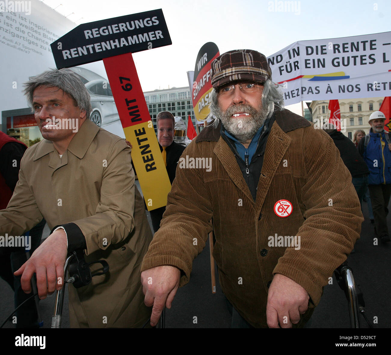 Costumed as elderly people, demonstrators protest with wheelchairs ...