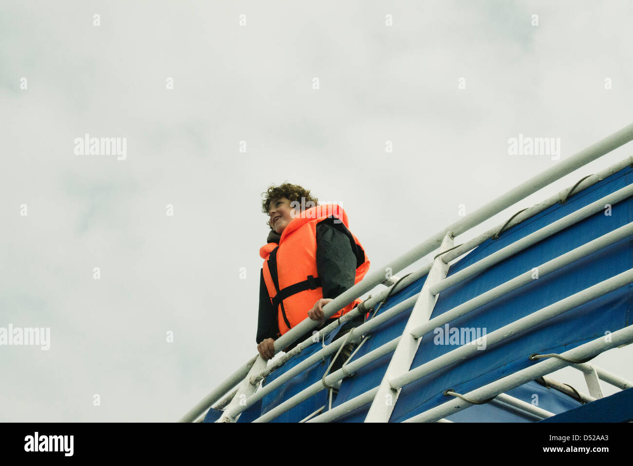Boy smiling face on the horizon, on the upper deck of a boat Stock ...