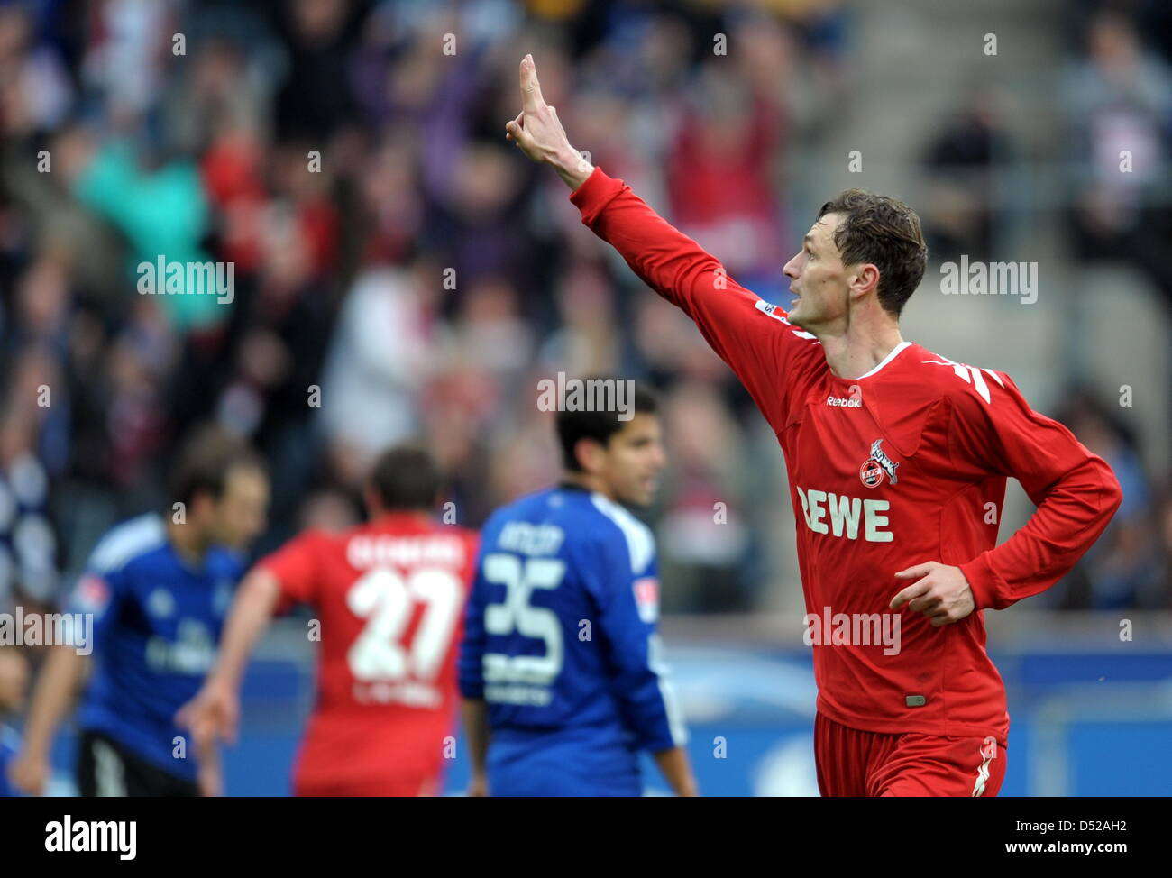 Cologne's Milivoje Novakovic celebrates his 3-2 goal ball during the ...