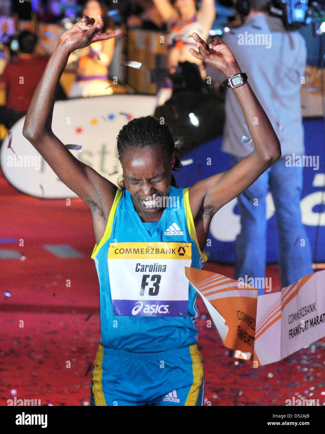Kenyan athlete Carolina Kilel cheers after she arrives at the finishing ...