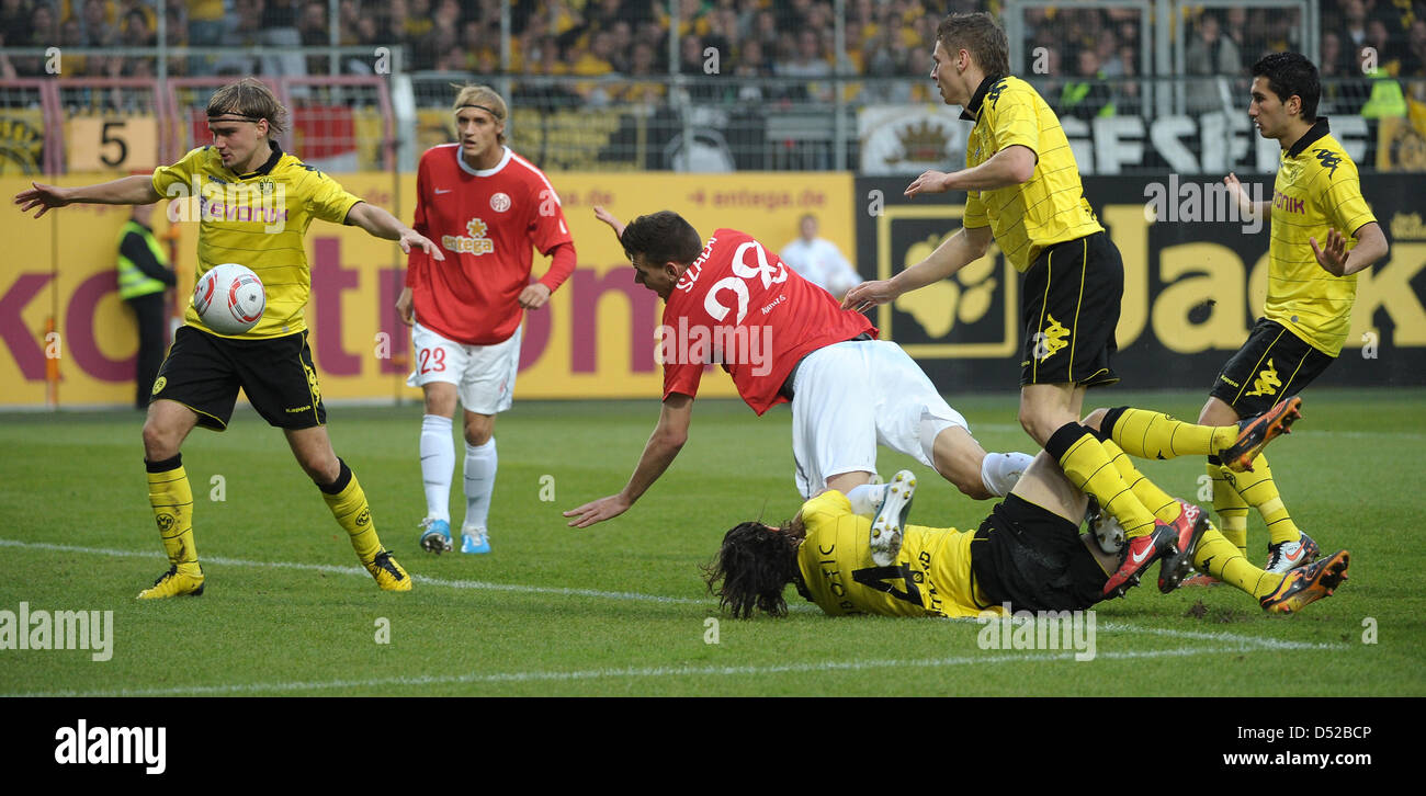 Dortmund's Neven Subotic (l)fouls Adam Szalai in the penalty area ...