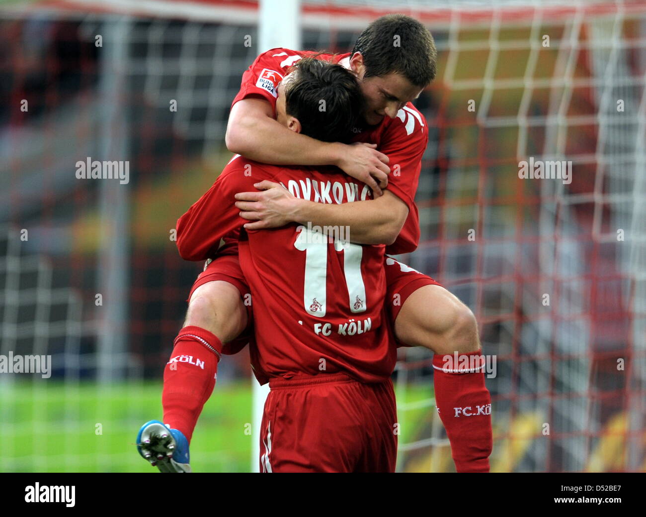 Cologne's Milivoje Novakovic and Christian Clemens celebrate after the ...
