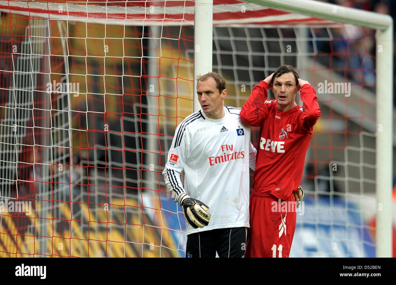 Hamburg's keeper Jaroslav Drobny hugs Cologne's Milivoje Novakovic ...