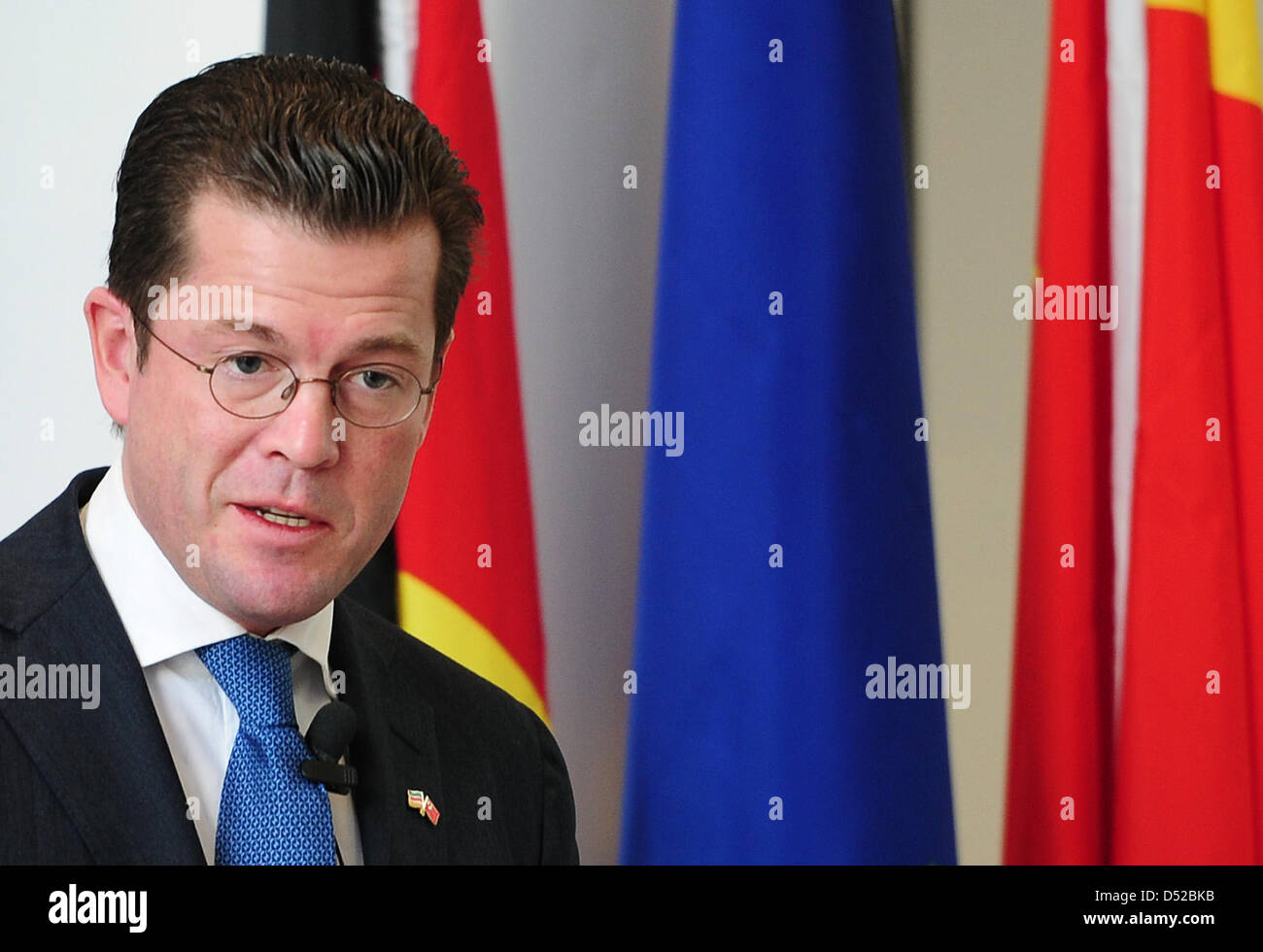 German Defence Minister Karl-Theodor zu Guttenberg holds his opening ...