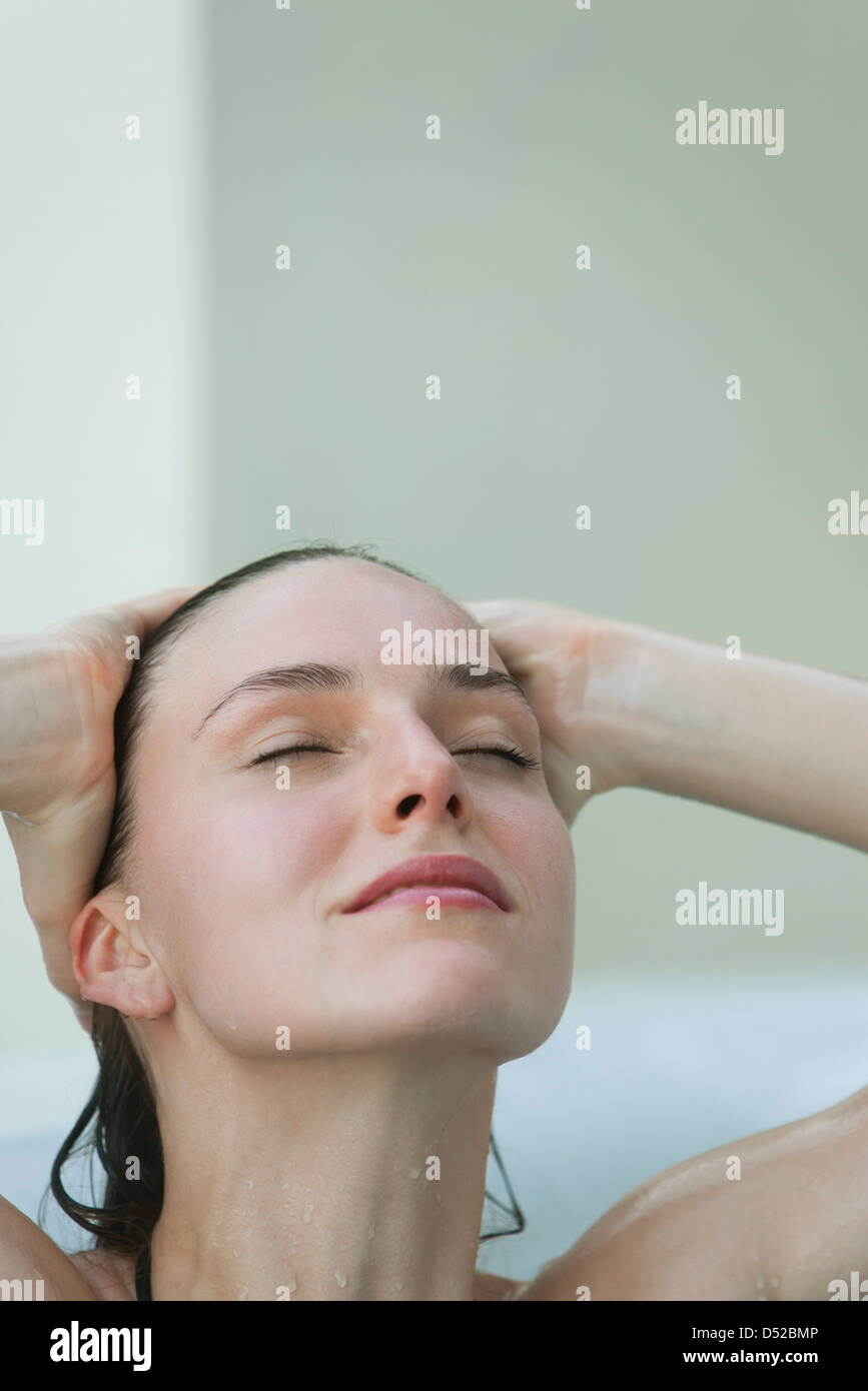 Woman bathing with eyes closes Stock Photo - Alamy