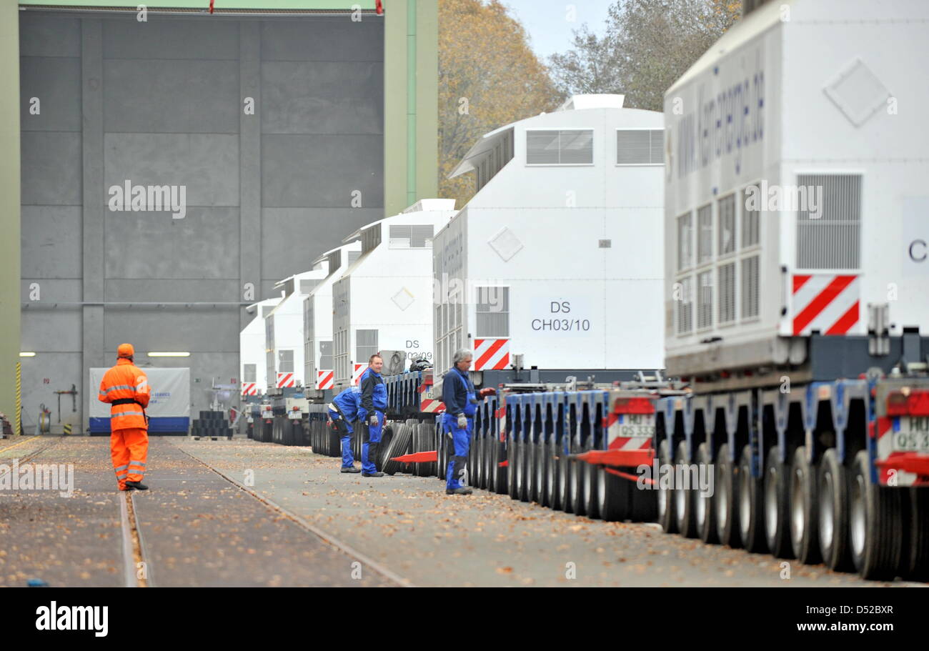 Shells for nuclear containers are loaded onto semi-trailers at the ...