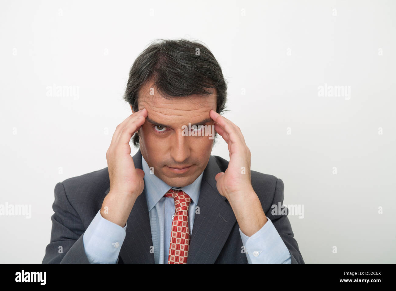 Mature man rubbing temples hi-res stock photography and images - Alamy