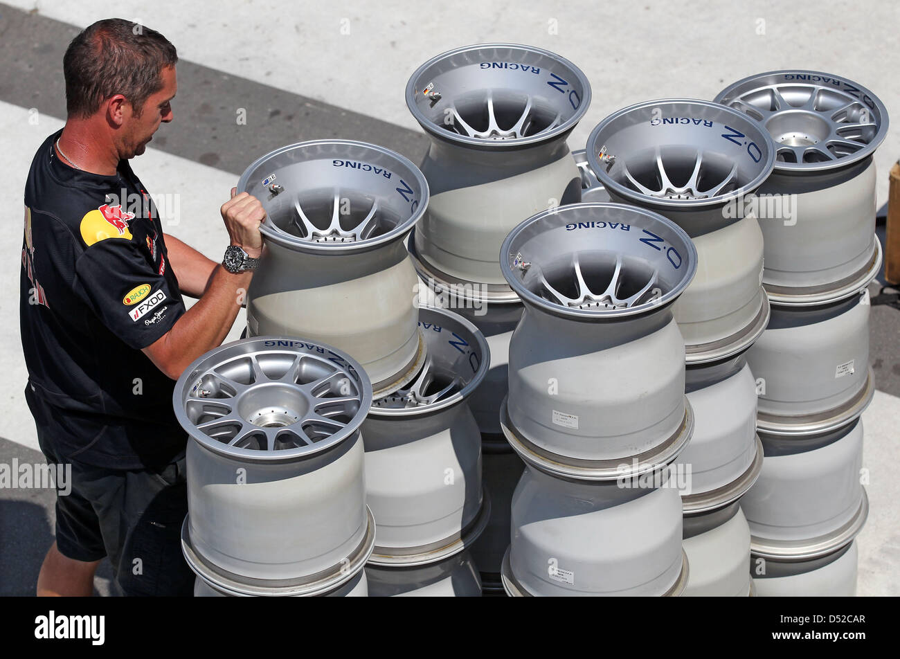 A mechanic of Red Bull assorts rims for the Brazilian Grand Prix in Sao ...