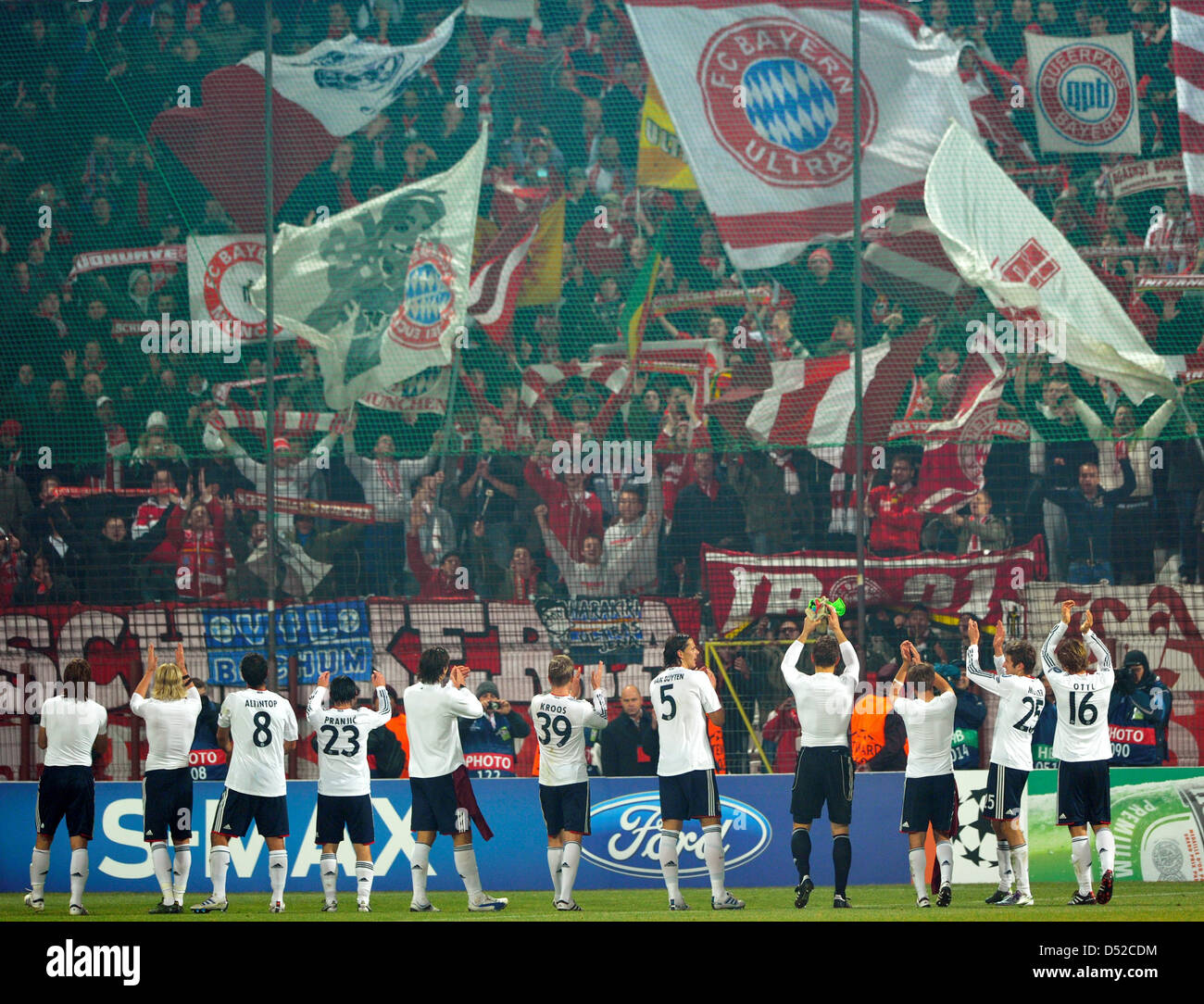 Bayern Munich's players salute their fans (background) who celebrate ...