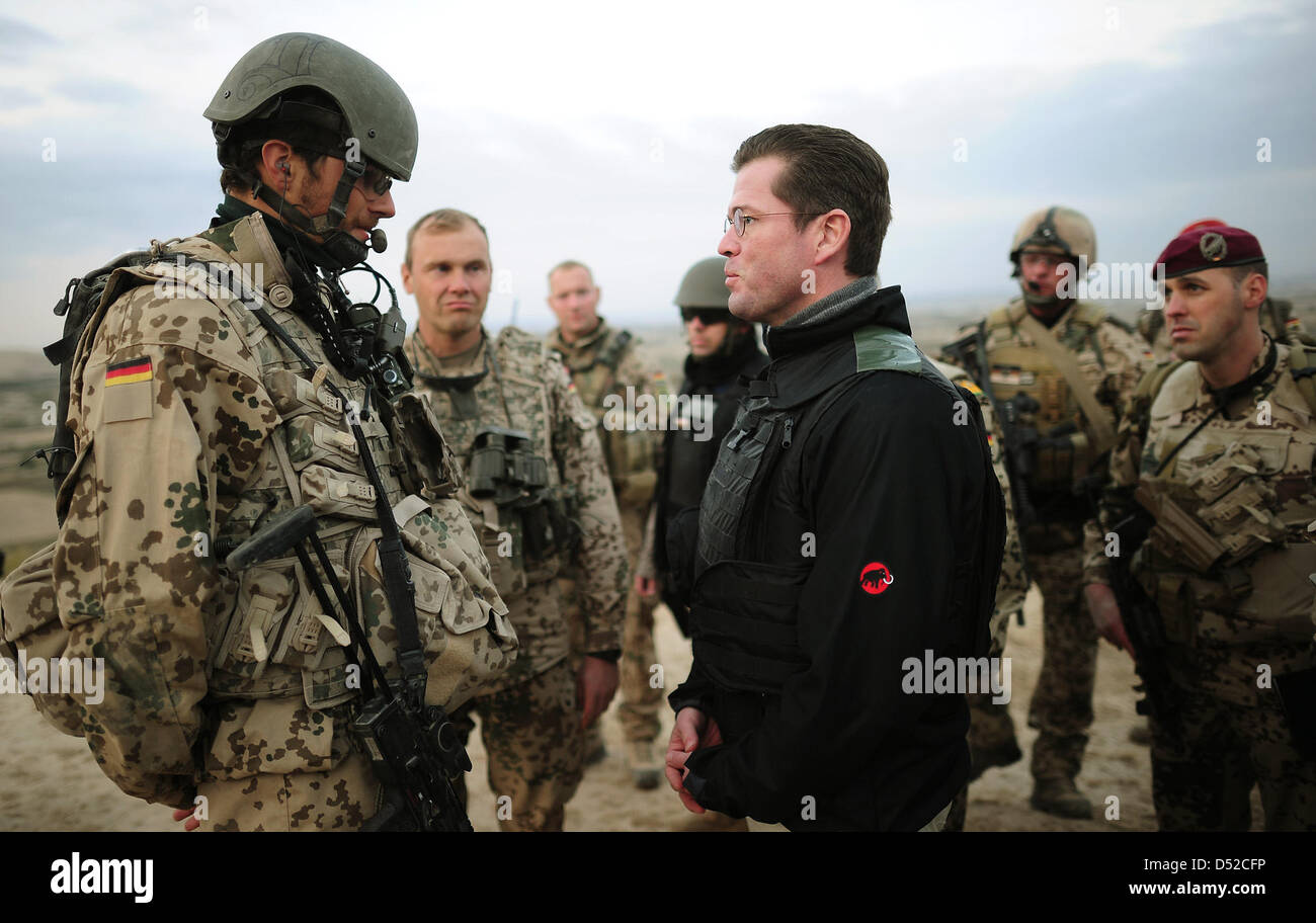 German Minister of Defence Karl-Theodor zu Guttenberg (C-R) visits ...