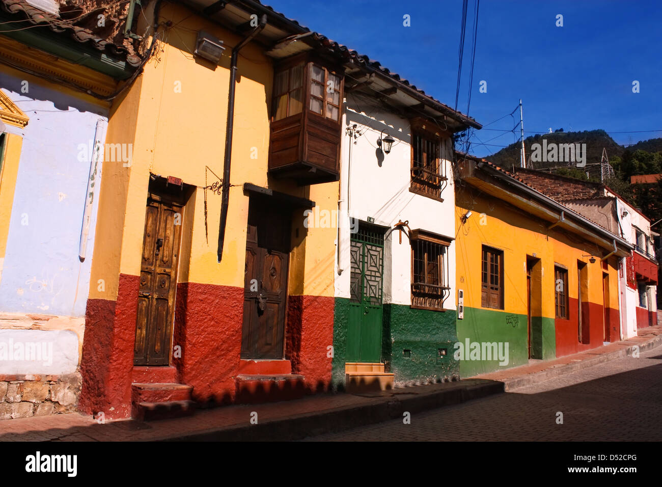 Street in the spanish colonial neighborhood of La Candelaria, Bogota ...