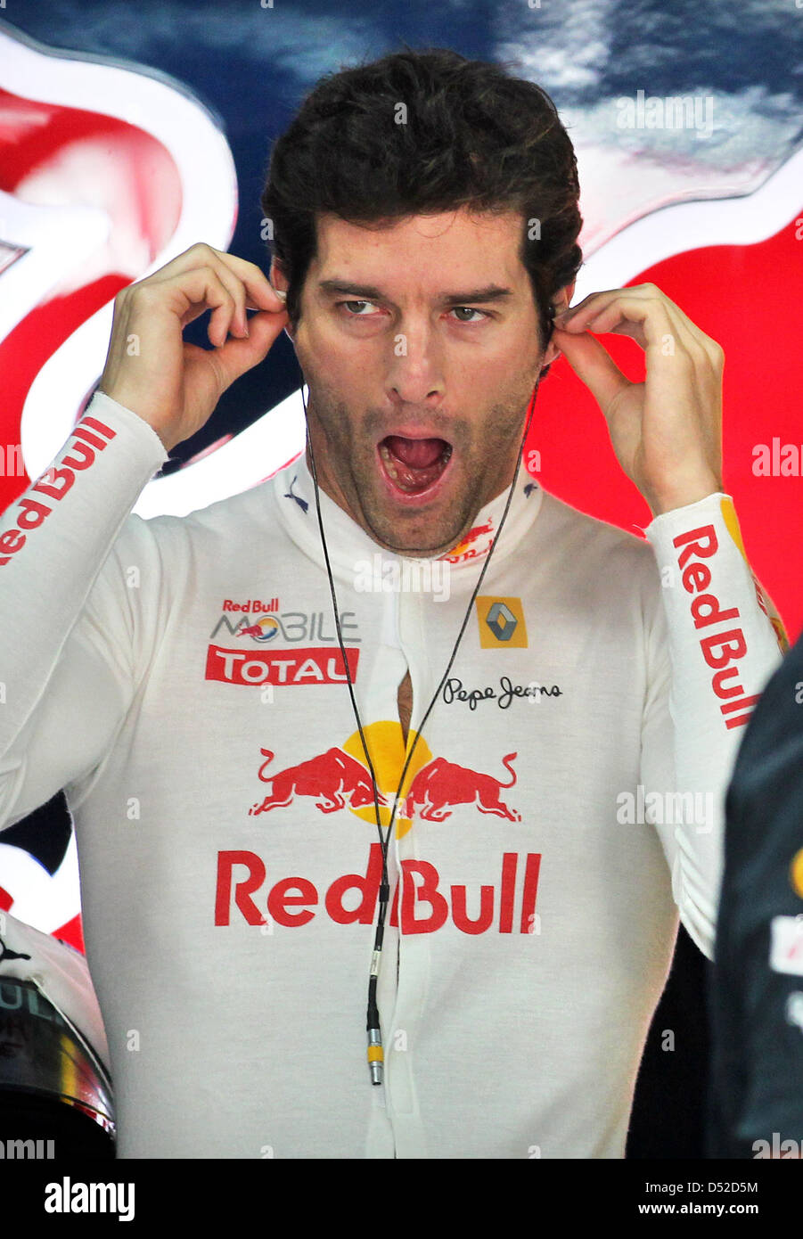 Australian driver Webber of Red Bull stands in his team's garage during ...
