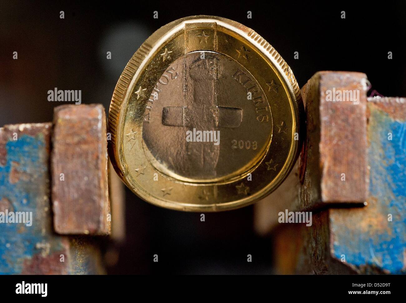 ILLUSTRATION - An illustrated picture shows a bent Cypriot euro coin ...