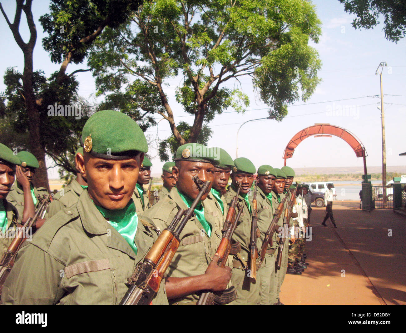 Soldiers of the Malian army stand attention in the training camp in ...