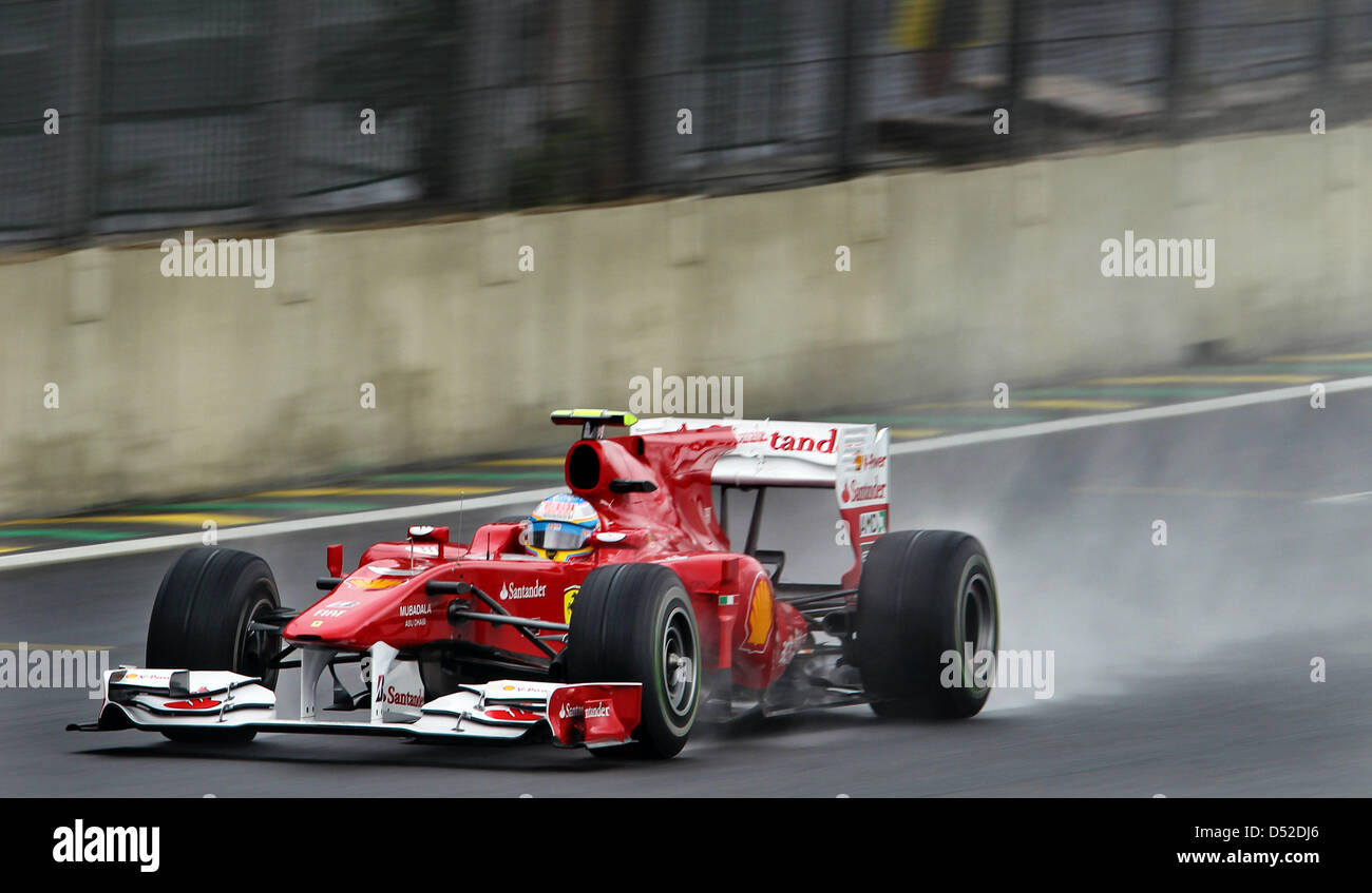 Spanish driver Fernando Alonso of Ferrari steers his car across the ...