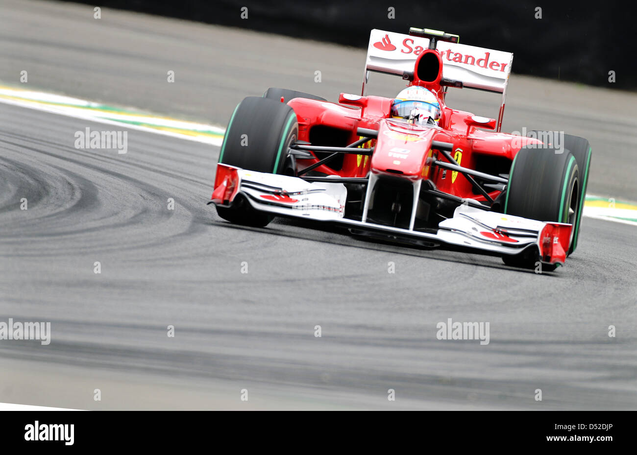 Spanish driver Fernando Alonso of Ferrari drives his car along the race ...