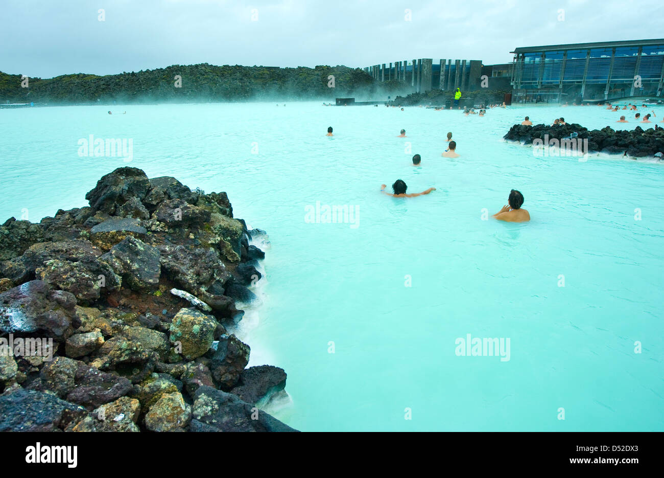 People bathing in the Blue Lagoon geothermal bath resort in Iceland ...