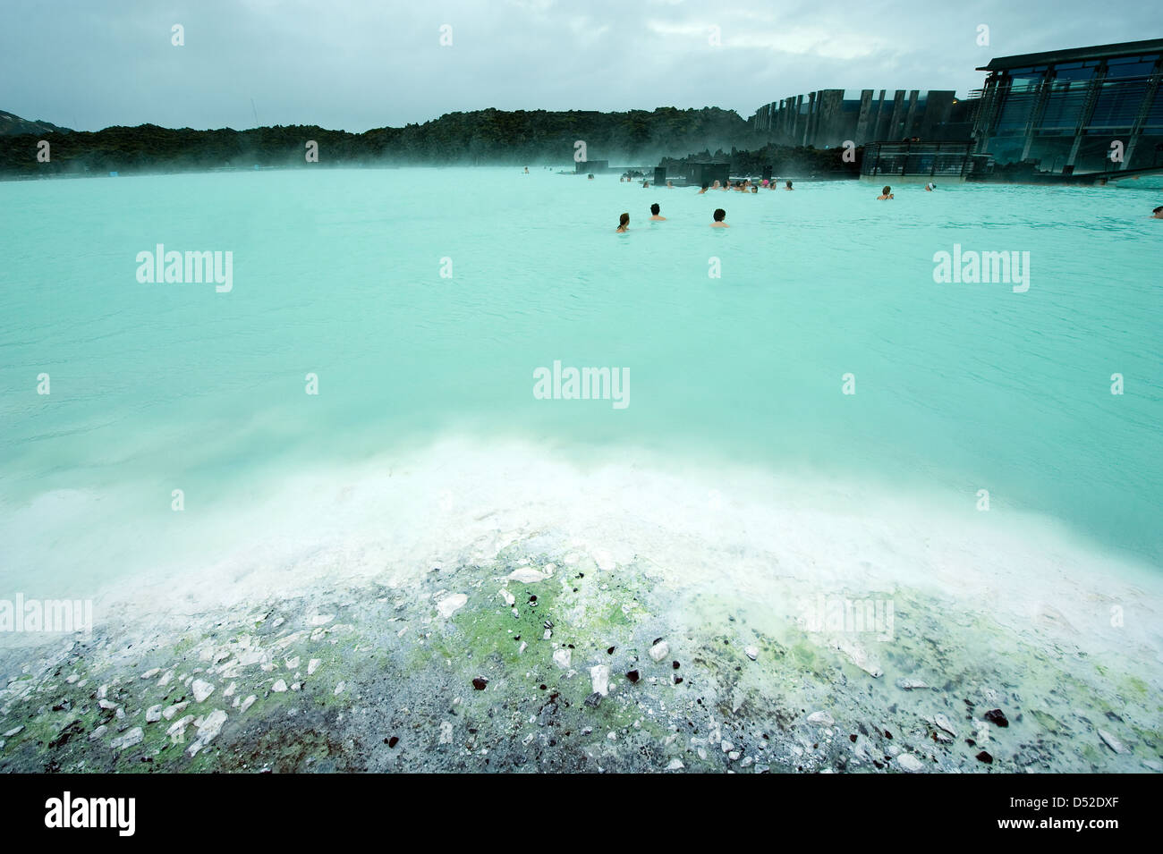People bathing in the Blue Lagoon geothermal bath resort in Iceland ...