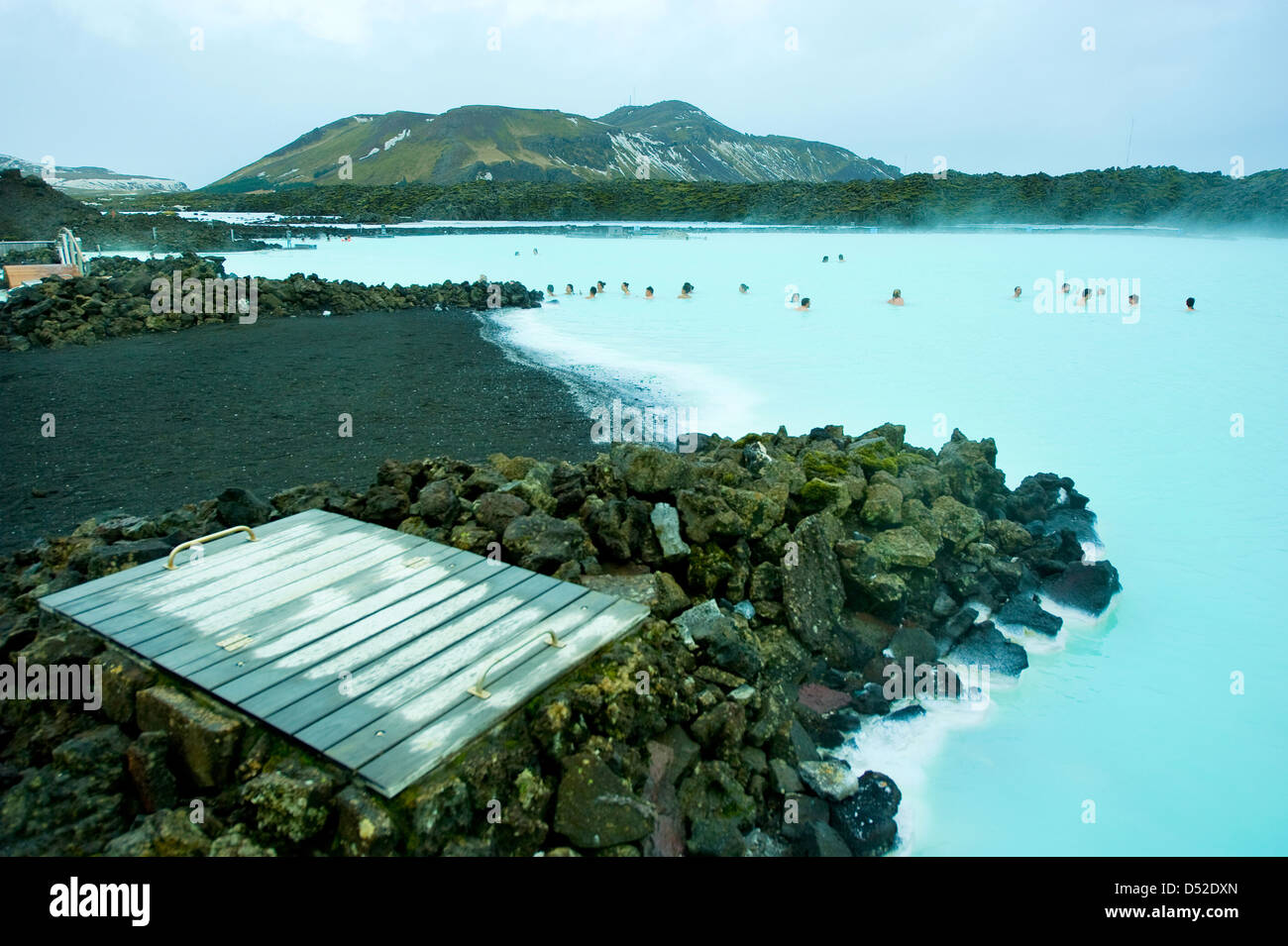 People bathing in the Blue Lagoon geothermal bath resort in Iceland ...