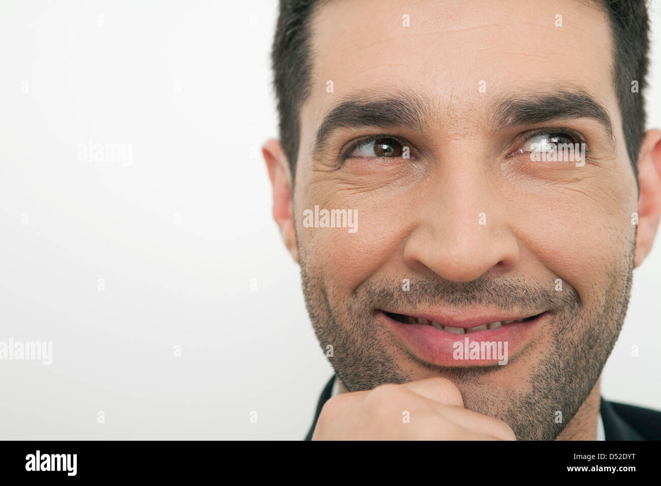 Mid-adult man daydreaming, smiling Stock Photo - Alamy