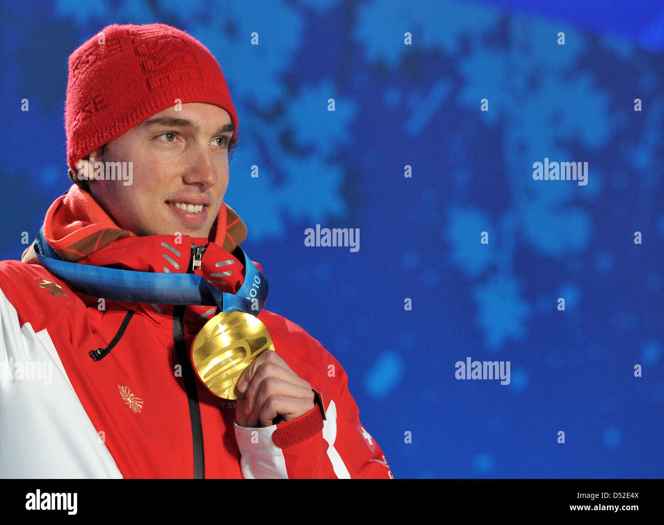 Carlo Janka of Switzerland shows his gold medal during the Medal ...