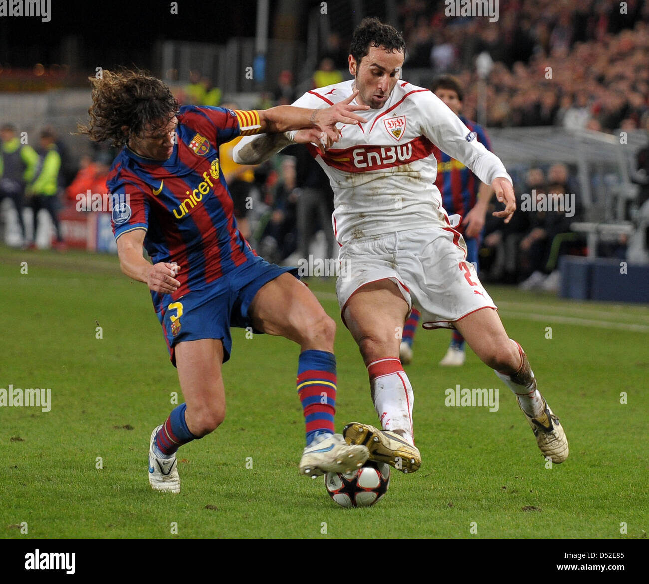 Stuttgart's Cristian Molinaro (R) fights for the ball with Barcelona's ...