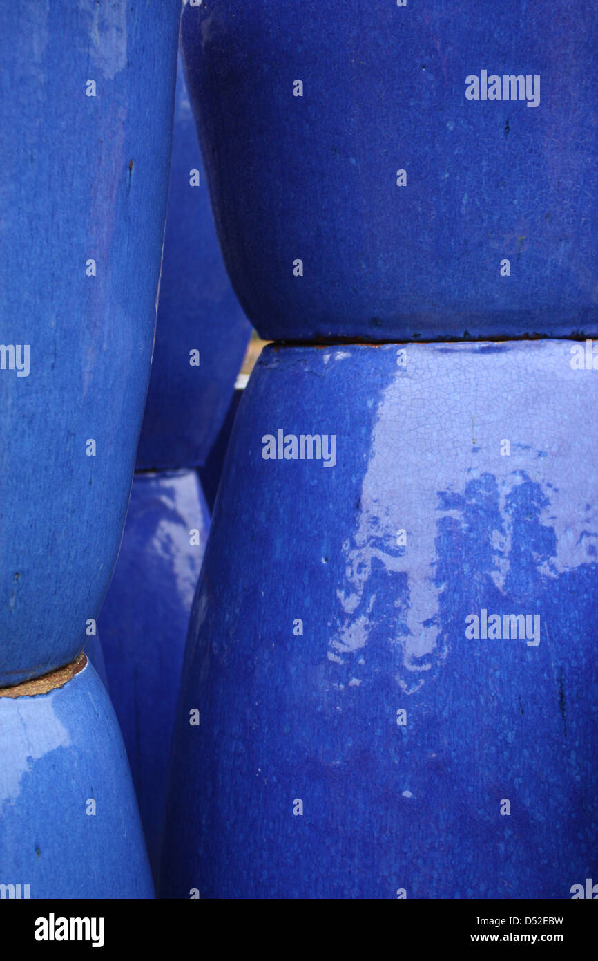 bright blue ceramic pots stacked Stock Photo - Alamy