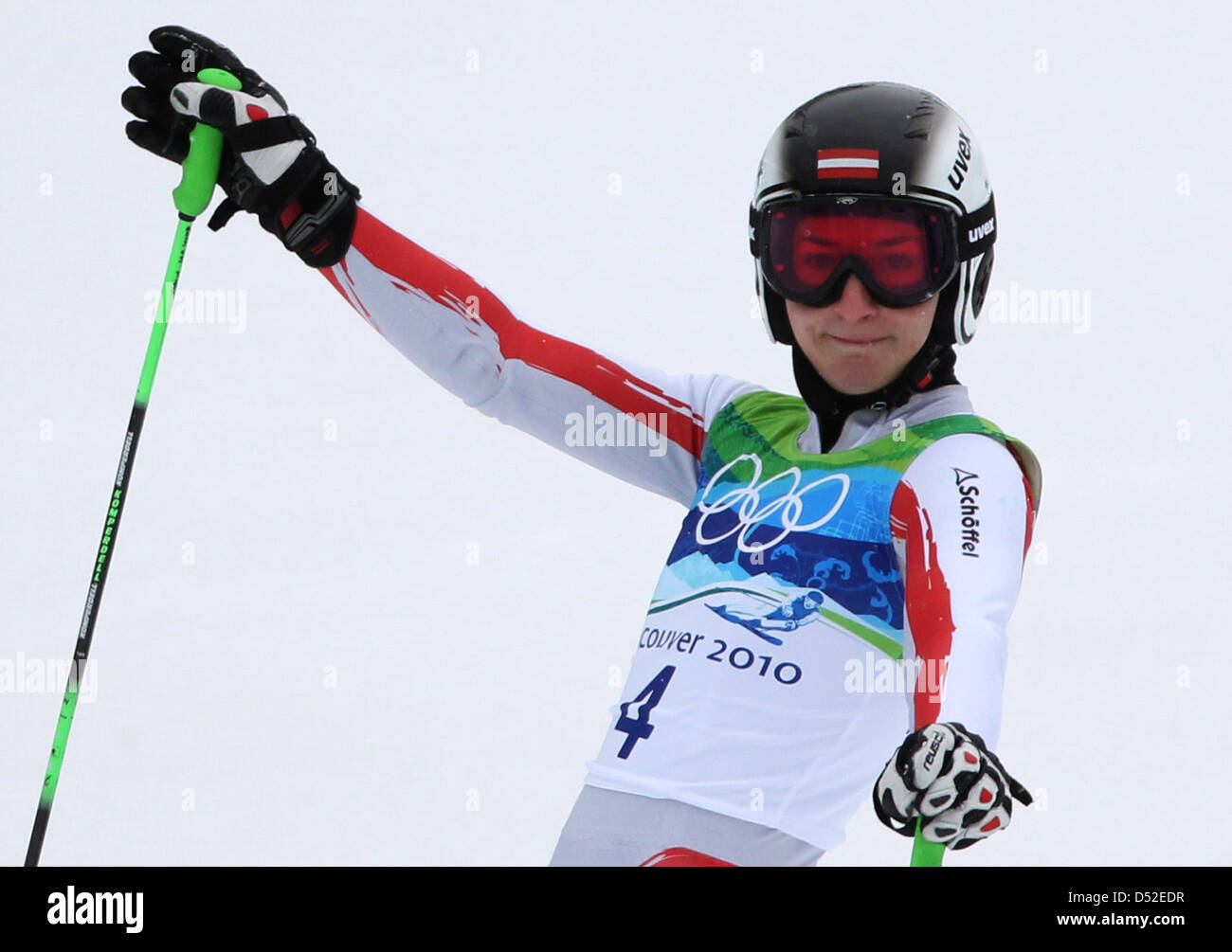 Kathrin Zettel of Austria reacts in the finish area after her first run ...