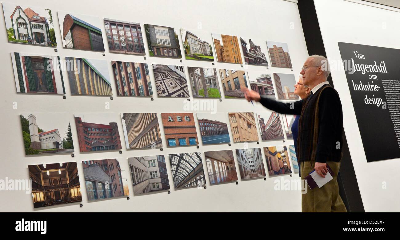 Visitors view photos of houses designed by Behrens at the exhibition ...