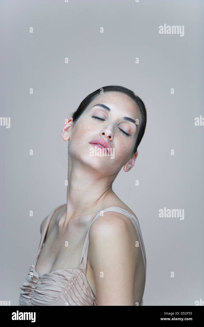 Young woman with head back and eyes closed, portrait Stock Photo - Alamy