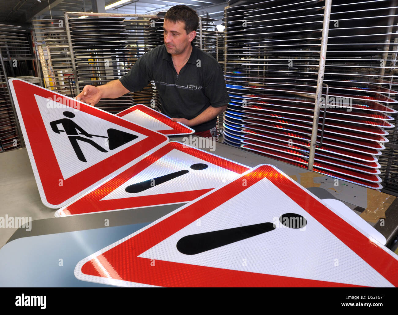 Traffic signs symbolising 'Contruction Site', 'Road Damage' and ...