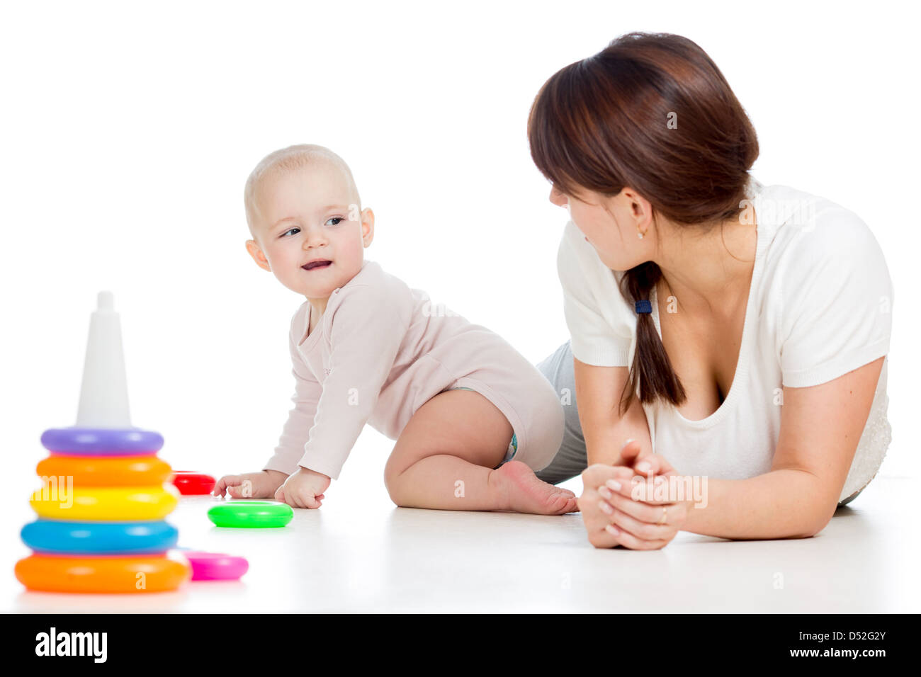 baby girl and mother playing together with colorful toys Stock Photo ...